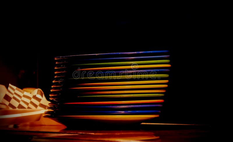 Stack of Colorful Dishes stock photo. Image of anticipation - 196230484