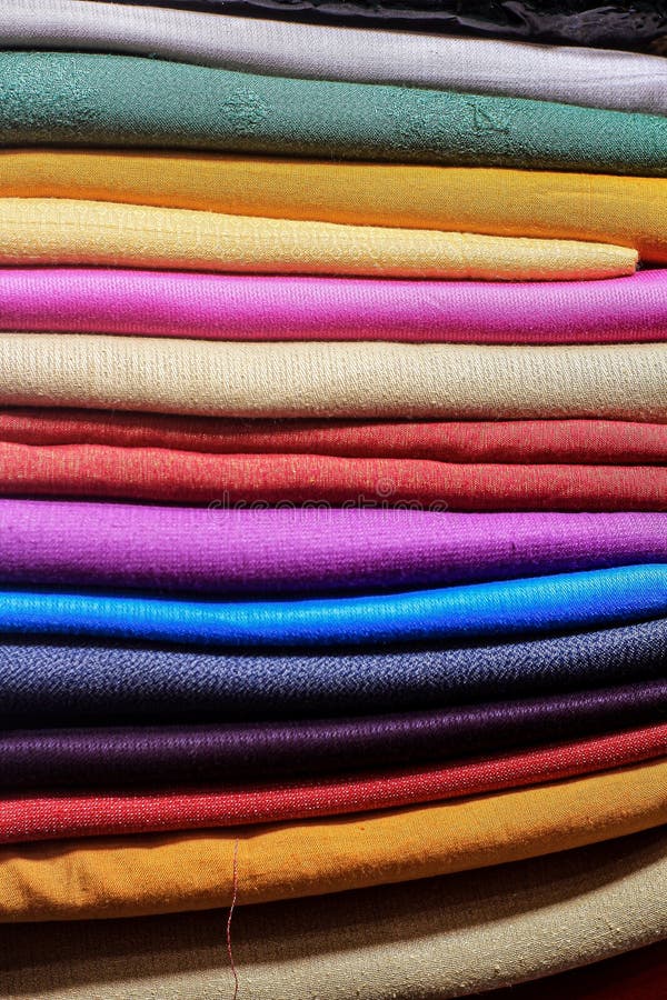Stack of Colorful Fabrics Layered Horizontally, Showcasing a Variety of ...