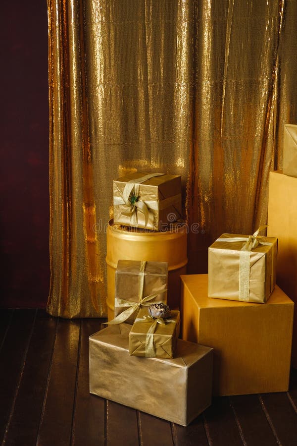 Stack of Colorful Gift Boxes in Golden Wrapping Paper with Ribbons ...