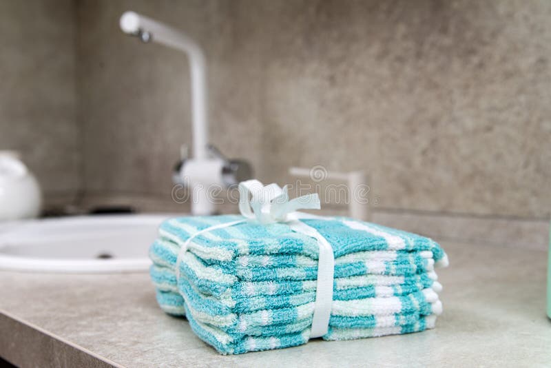 Stack of Colorful Kitchen Towels on the Kitchen Table Next To the Sink ...