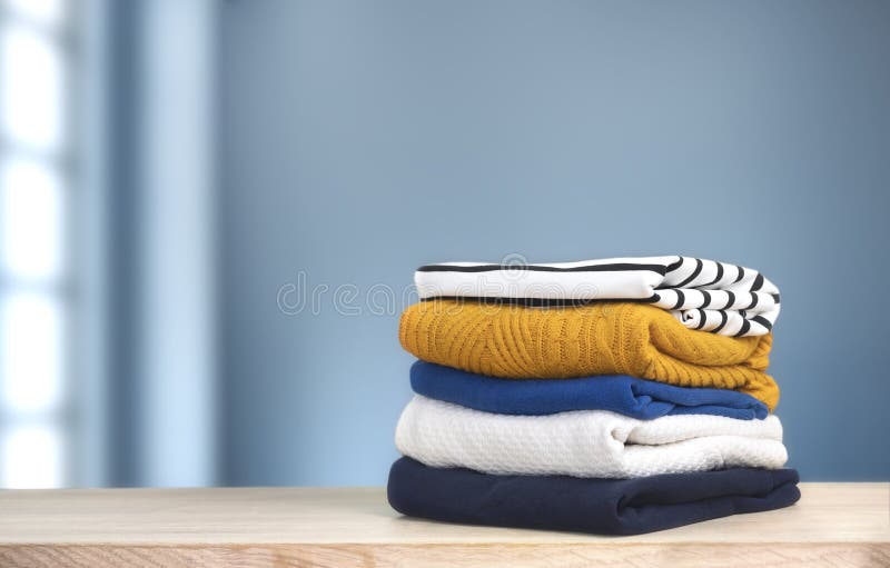 Stack of Colorful Knitted Folded Clothes on Wooden Table Empty Space ...