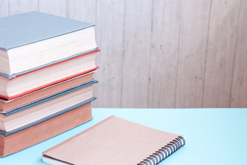 Stack of Colorful Old Hardback Books with Brown Notebook. Many Books ...