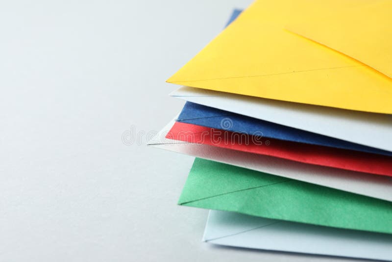 Stack of Colorful Envelopes on Light Background, Closeup. Space for ...
