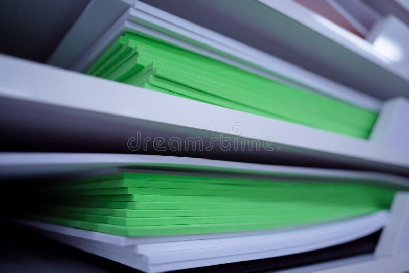 A Stack of Colorful Paper Folded in a Warehouse Stock Photo - Image of ...