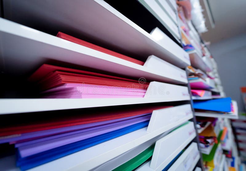 A Stack of Colorful Paper Folded in a Warehouse Stock Photo - Image of ...
