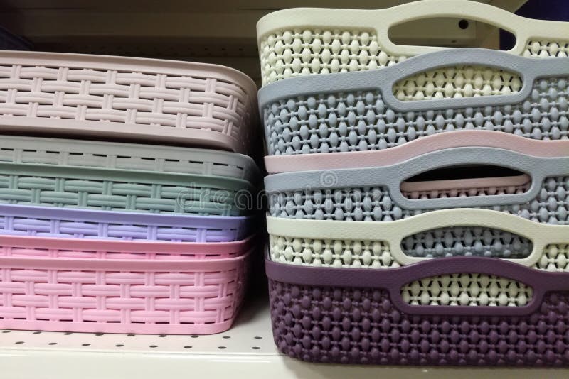 Stack of Colorful Plastic Baskets on the Shelf Stock Photo - Image of ...