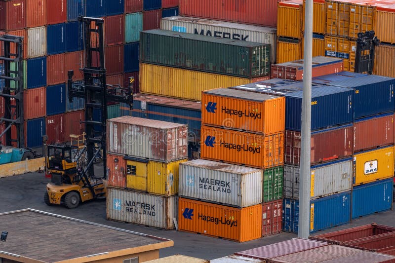 A Stack of Colorful Shipping Containers and a Forklift at a Port ...