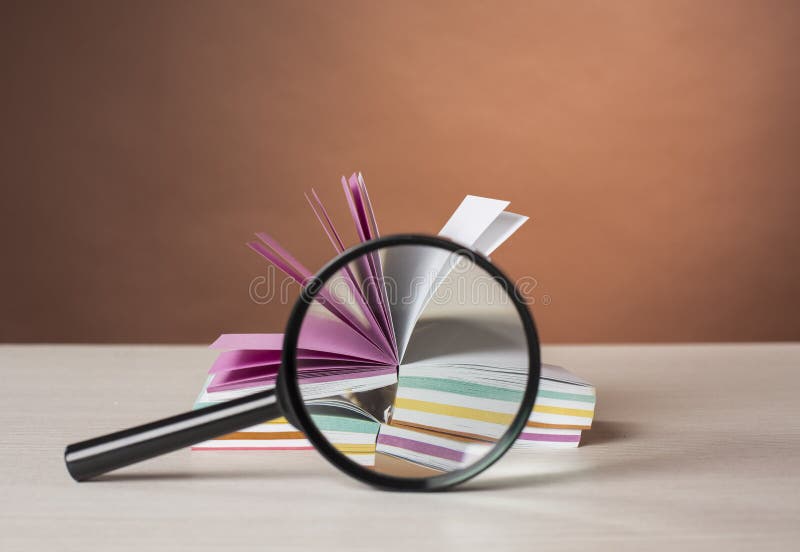 Stack of Colorful Stickers and Magnifying Glass Stock Photo - Image of ...