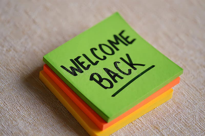 Brightly Colored Sticky Notes Stacked with a Handwritten Welcome Back ...