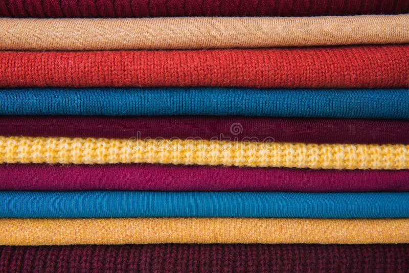 A Stack of Colorful Things, Clothes, Neatly Stacked on a Shelf. the ...