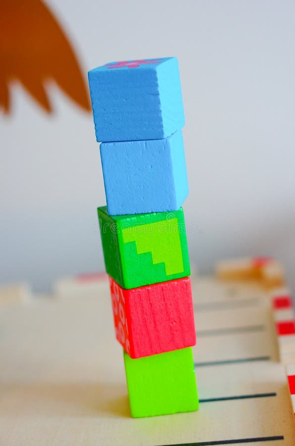 Stack of Colorful Toy Cubes on a Blurred Background Stock Photo - Image ...