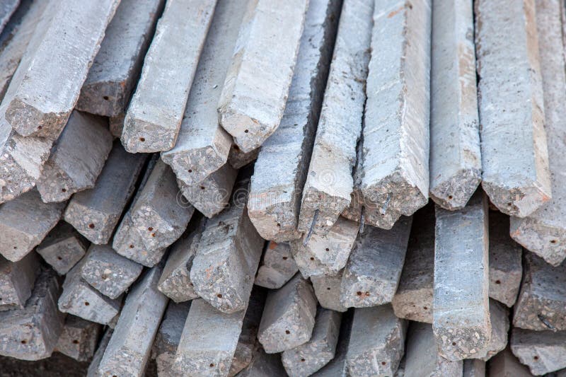 A Stack of Concrete Beams Ready for Use in Construction, Showcasing ...