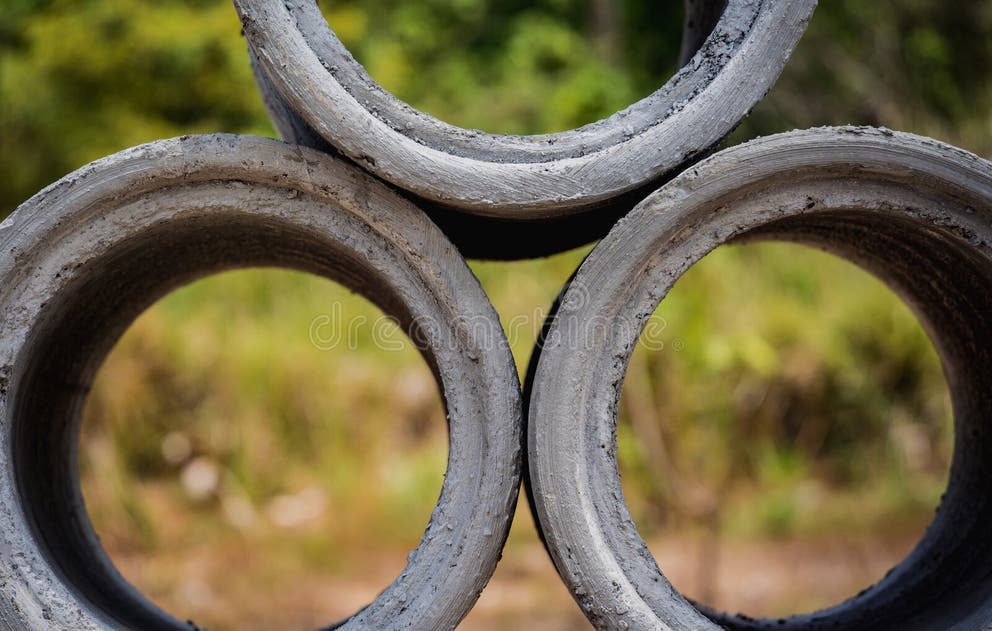 A Stack of Concrete Ring Pipes Piled and Creating a Symmetrical ...