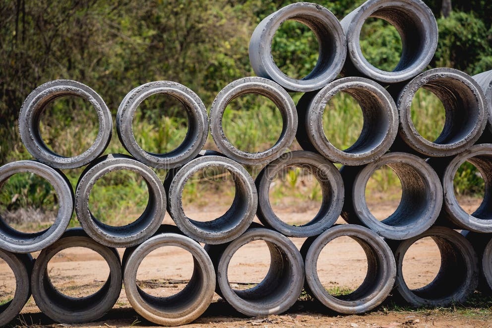 A Stack of Concrete Ring Pipes Piled and Creating a Symmetrical ...
