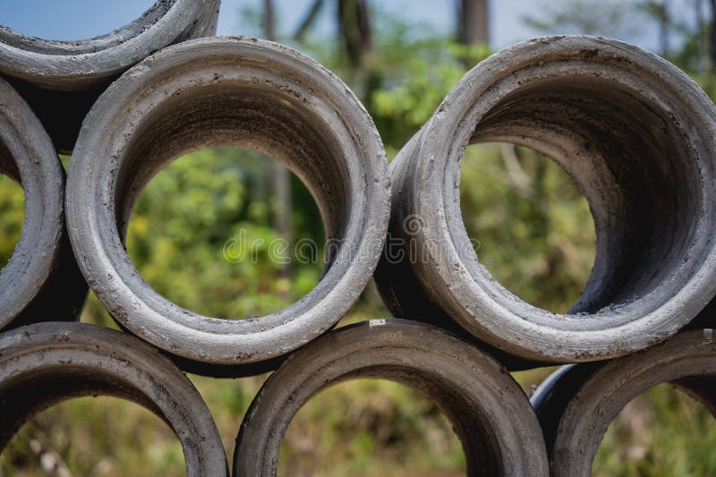 A Stack of Concrete Ring Pipes Piled and Creating a Symmetrical ...