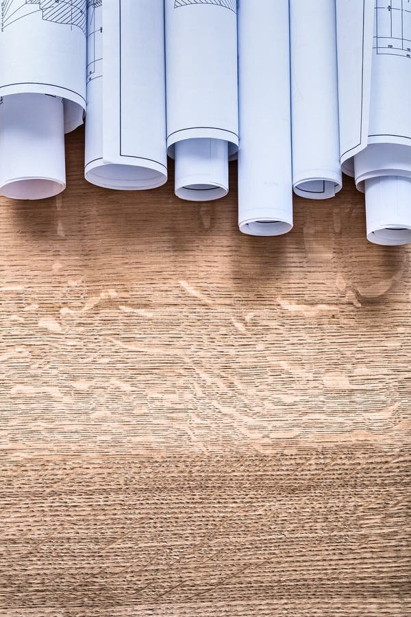 Stack of Construction Plans on Wooden Oaken Board Stock Photo - Image ...