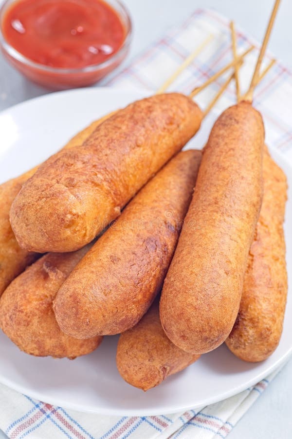 Stack of Corn Dogs on White Plate, Served with Ketchup, Vertical ...