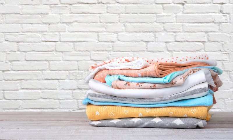 Stack Pile Folded Cotton Clothes on White. Stock Photo - Image of baby ...