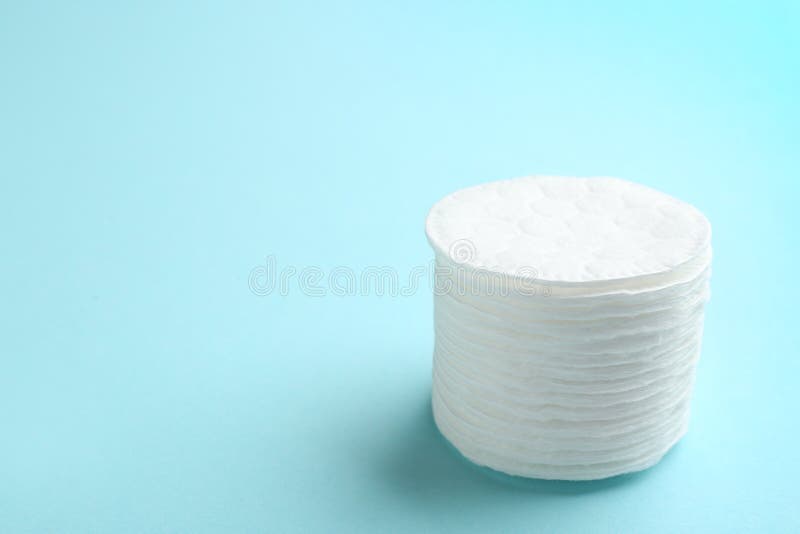 Stack of Cotton Pads on Color Background. Stock Photo - Image of care ...