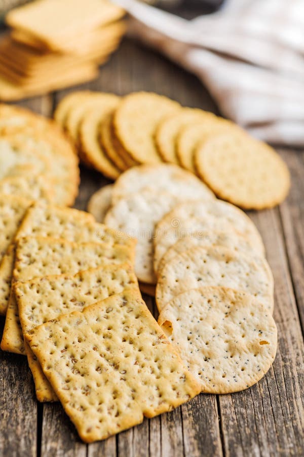 A Stack of Crackers Neatly Arranged on Wooden Tabletop Stock Photo ...