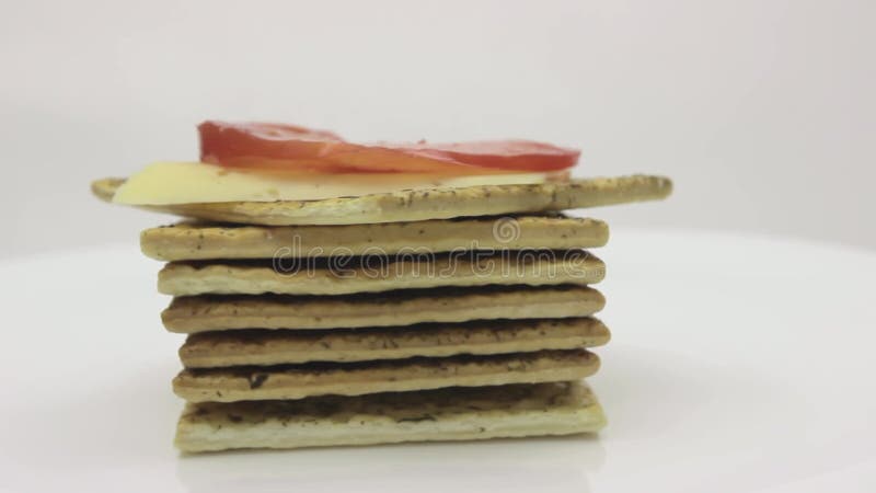 Stack of Crackers, Toast with Cheese and Tomato Rotates on a White ...