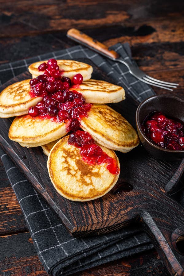 Stack of Cranberry Syrup Pancakes on Wooden Board. Dark Wooden ...