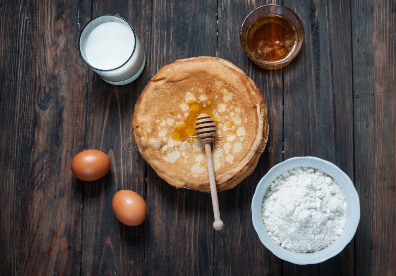 Stack of Crepes and Ingredients for Cooking on a Wooden Table Stock ...