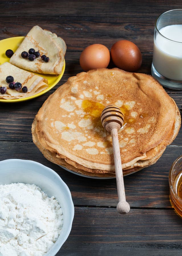 Stack of Crepes and Ingredients for Cooking on a Wooden Table Stock ...