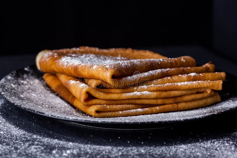 Stack of Crepes with Powdered Sugar on Dark Background. Stock Photo ...