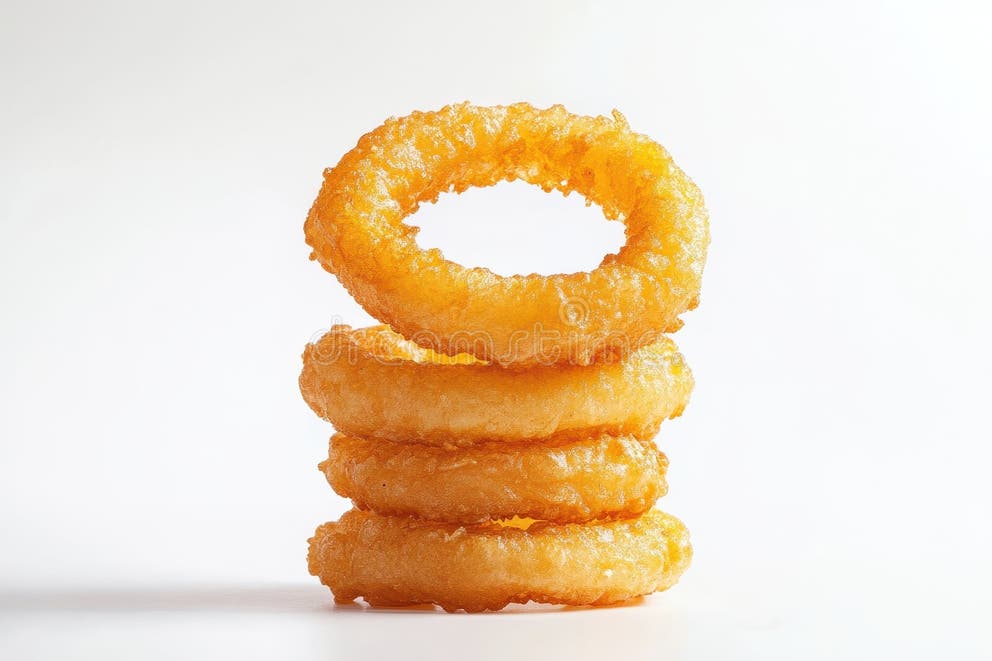 A Stack of Crispy, Golden Onion Rings on a White Background Stock ...