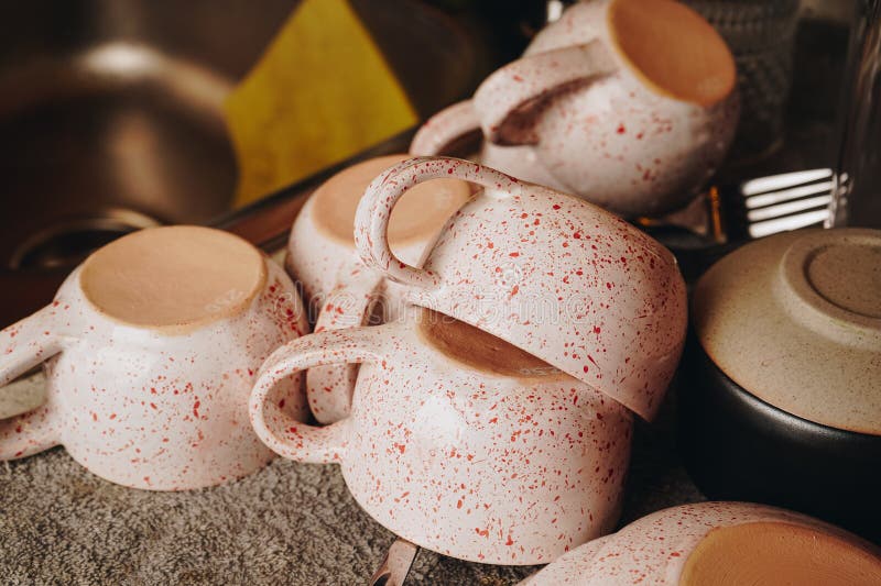 A Stack of Cups on the Table. Cups of Different Colors and Sizes ...