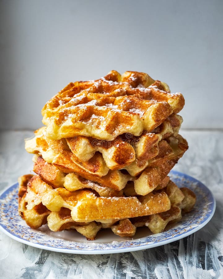 A Stack of Curd Waffles with Icing Sugar on a Light Plate Close-up ...