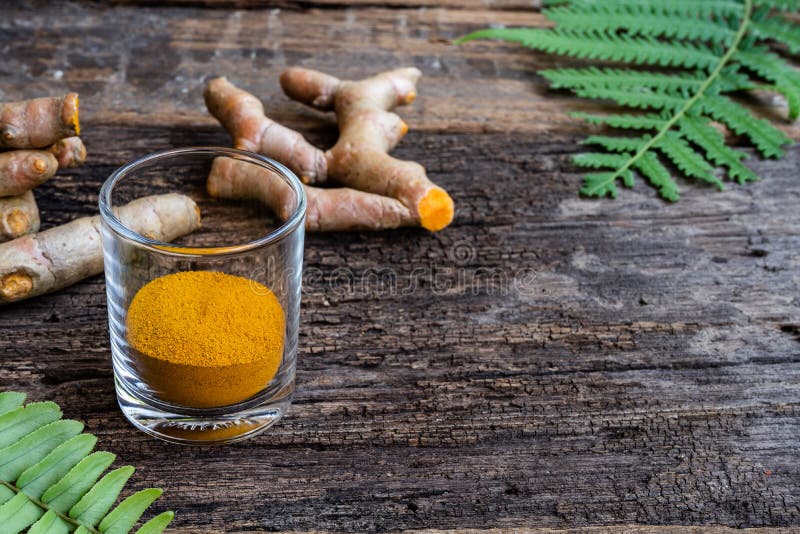 Stack of Cut Fresh Turmeric on Wood Background, Herb Concept ...