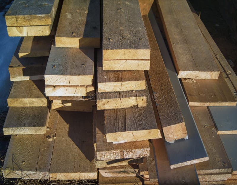 Stack of cut wooden boards stock photo. Image of outdoors - 244219210