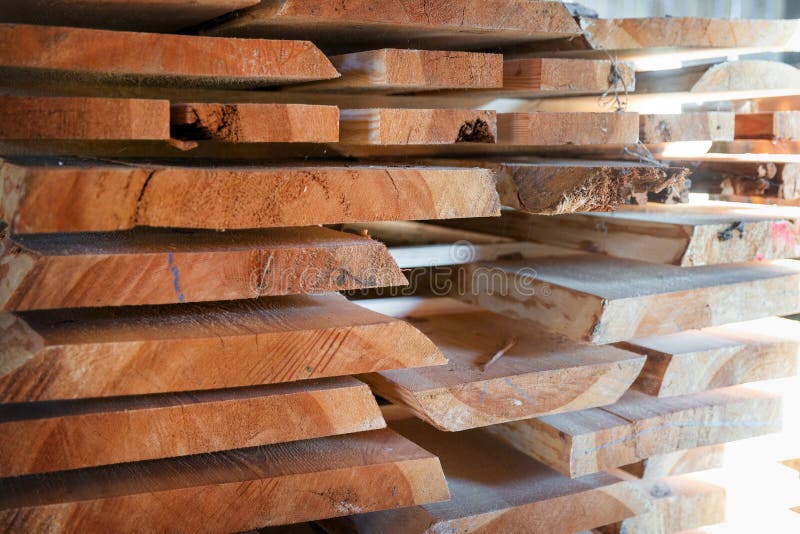 Stack of cut wooden boards stock photo. Image of plank - 195557548