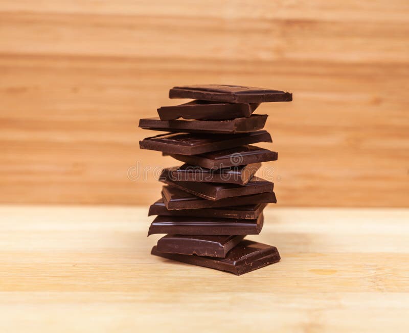 Stack of Dark Chocolate Pieces on Table Stock Photo - Image of ...