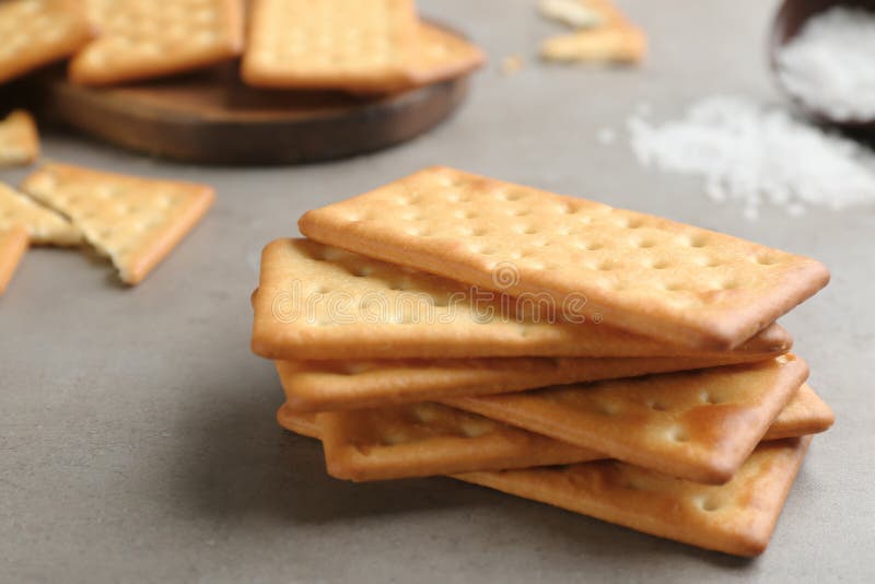 Stack of Delicious Crackers on Grey Table, Closeup Stock Image - Image ...