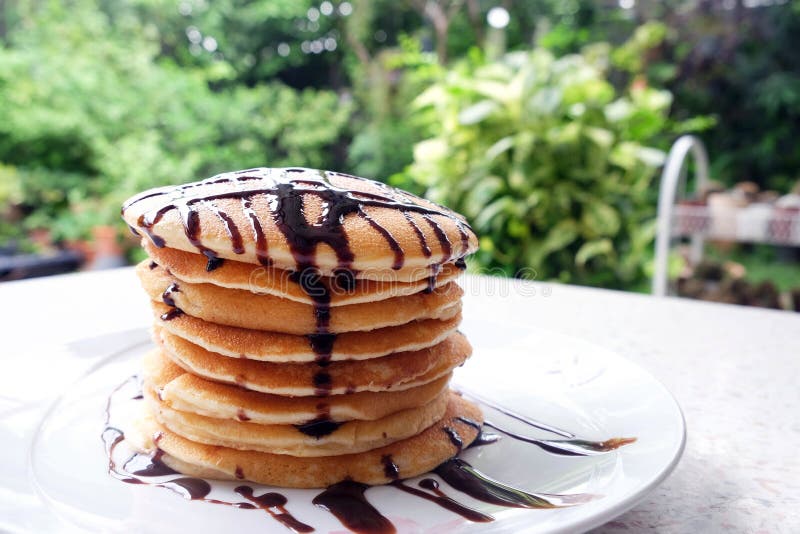 Stack of Delicious Pancakes with Chocolate Sauce on Plate on the Stock ...