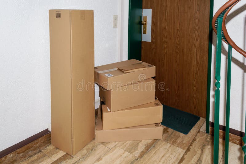 Stack of Delivered Packages in Front of a Door. Delivery Concept Stock ...