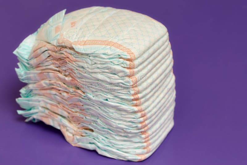 Stack of Diapers or Nappies on Purple Background Stock Image - Image of ...