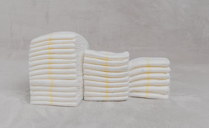 Stack of diapers on bed stock image. Image of cute, disposable - 227096583