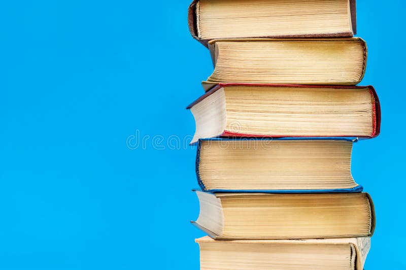 Stack of Different Books on Blue Background. Copy Space for Text Stock ...