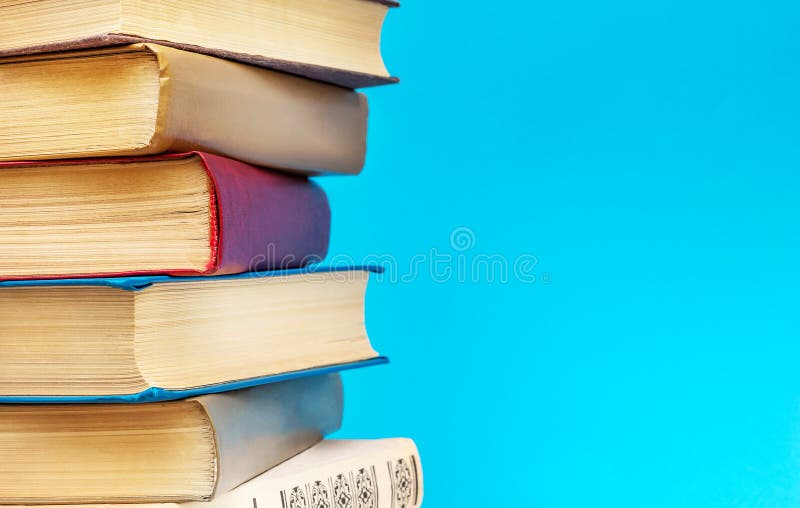 Stack of Different Books on Blue Background. Copy Space for Text Stock ...