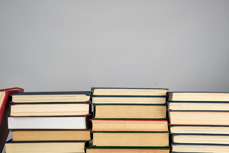 Stack Of Different Books On A Gray Background Stock Image - Image of ...