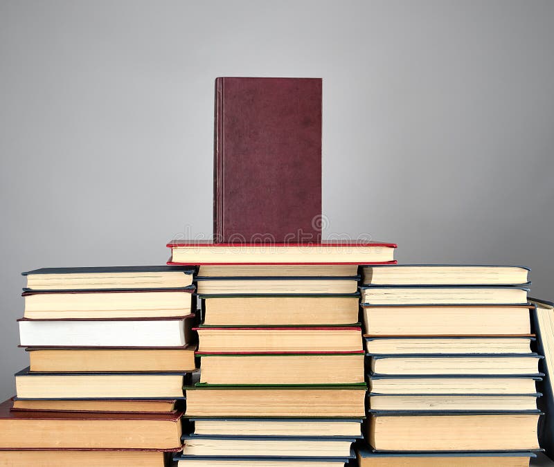 A Stack of Different Books on a Gray Background Stock Photo - Image of ...