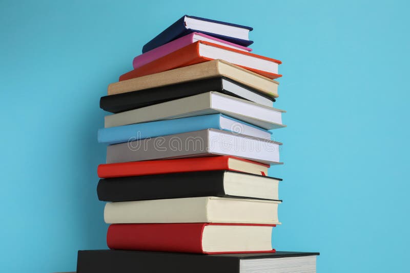 Stack of Different Books on Light Blue Background Stock Photo - Image ...