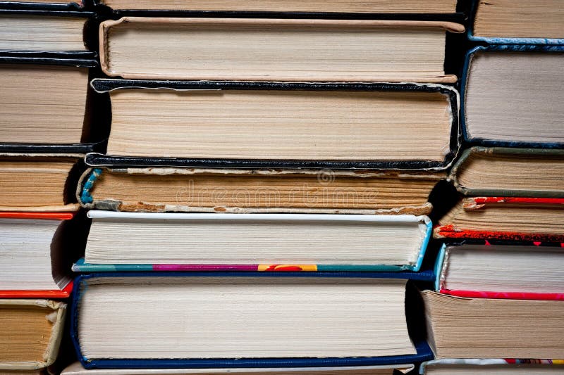 A Stack of Different Books of New and Old Folded Vertically Stock Photo ...