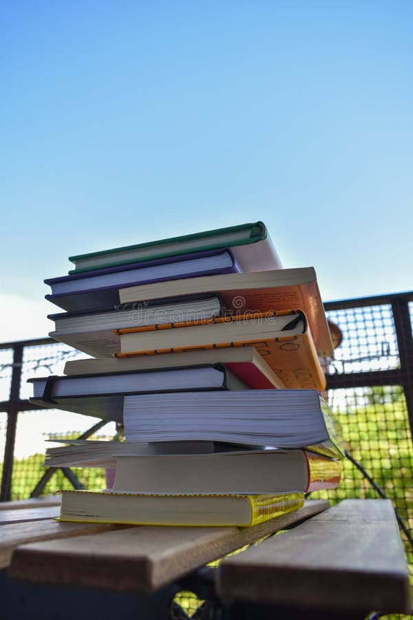 Stack of Different Books on the Table at Daytime Stock Photo - Image of ...