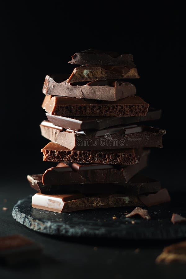 A Stack of Different Chocolate Pieces Stock Photo - Image of sugar ...