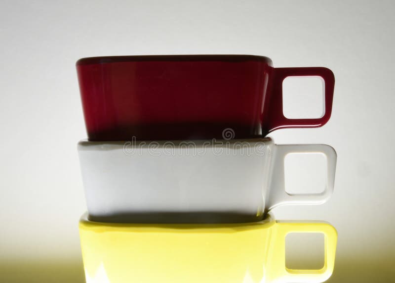 A Stack of Different Colored Coffee Cups Stock Photo - Image of colored ...